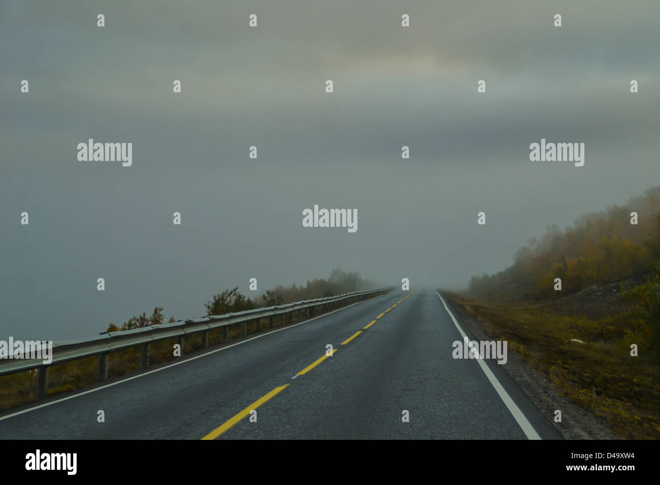 Misty road in the morning Stock Photo - Alamy