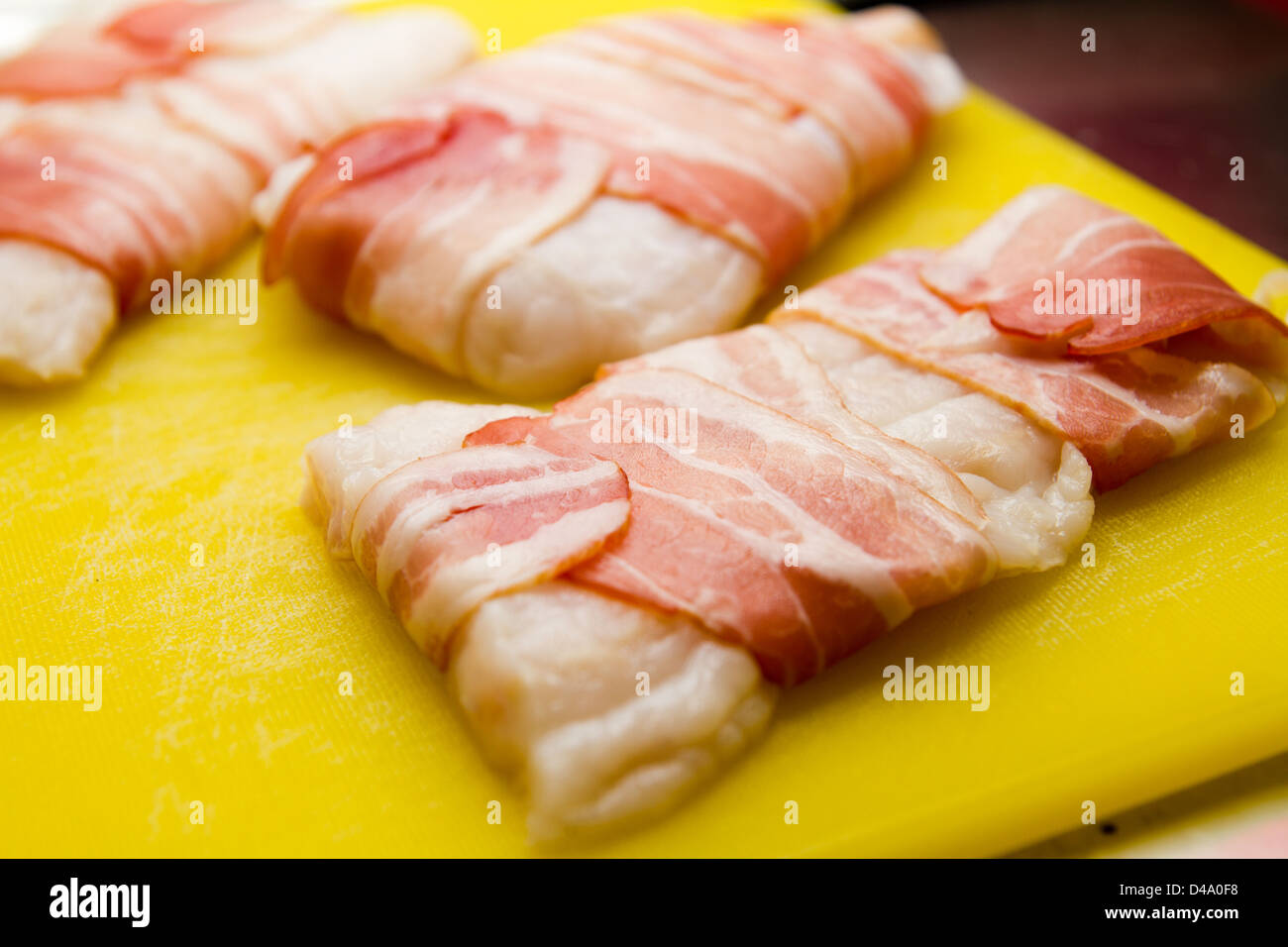 Catfish fillet wrapped in bacon Stock Photo - Alamy