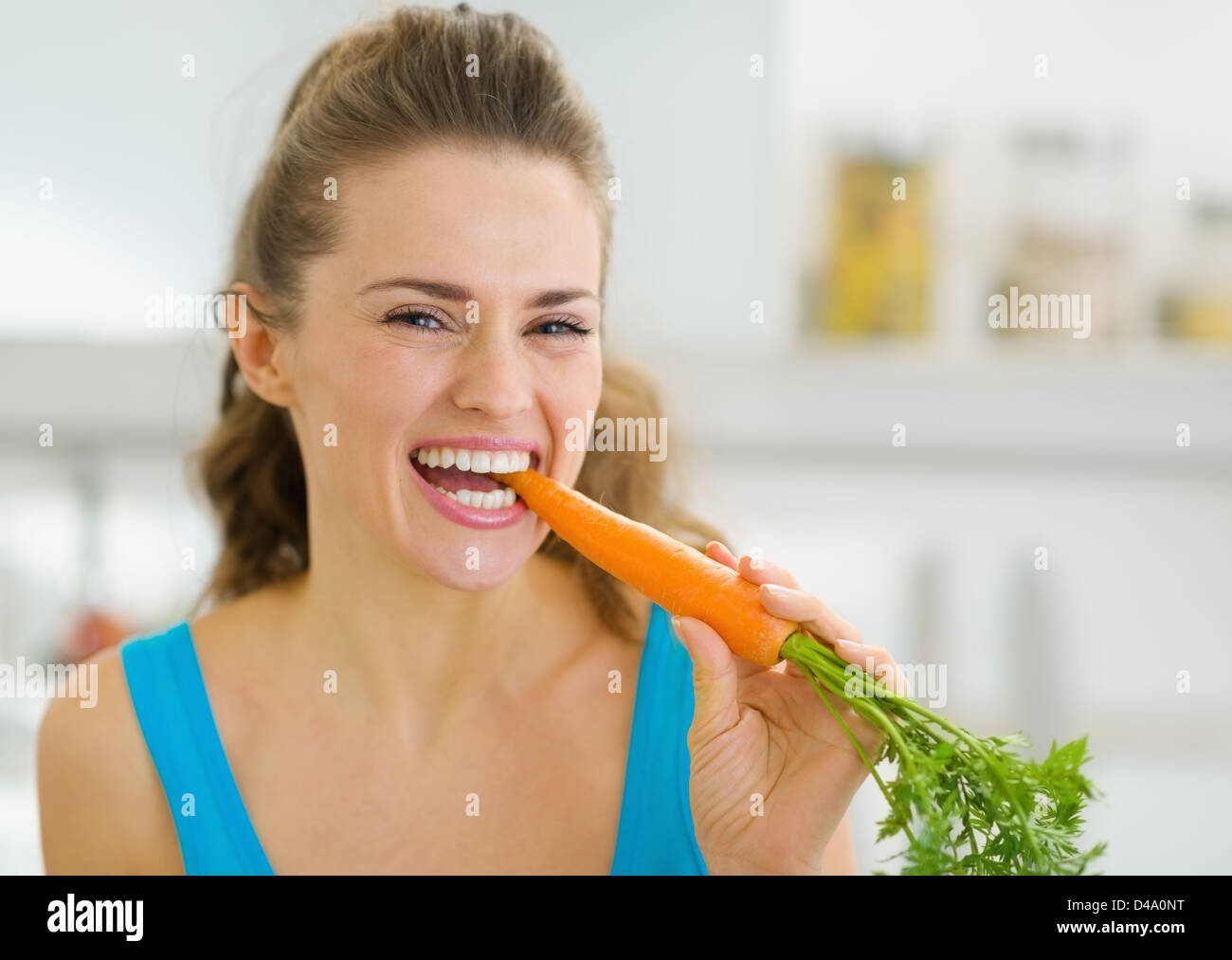 Woman eating carrot hi-res stock photography and images - Alamy