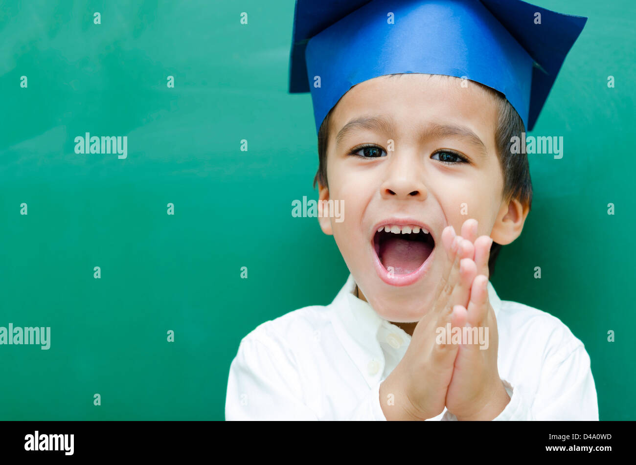 Successful Schoolboy very happy at Blackboard Stock Photo - Alamy