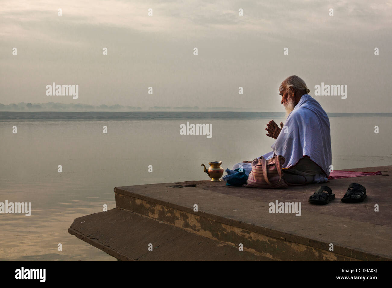 Indian man meditating at sunrise,Varanasi, India Stock Photo - Alamy