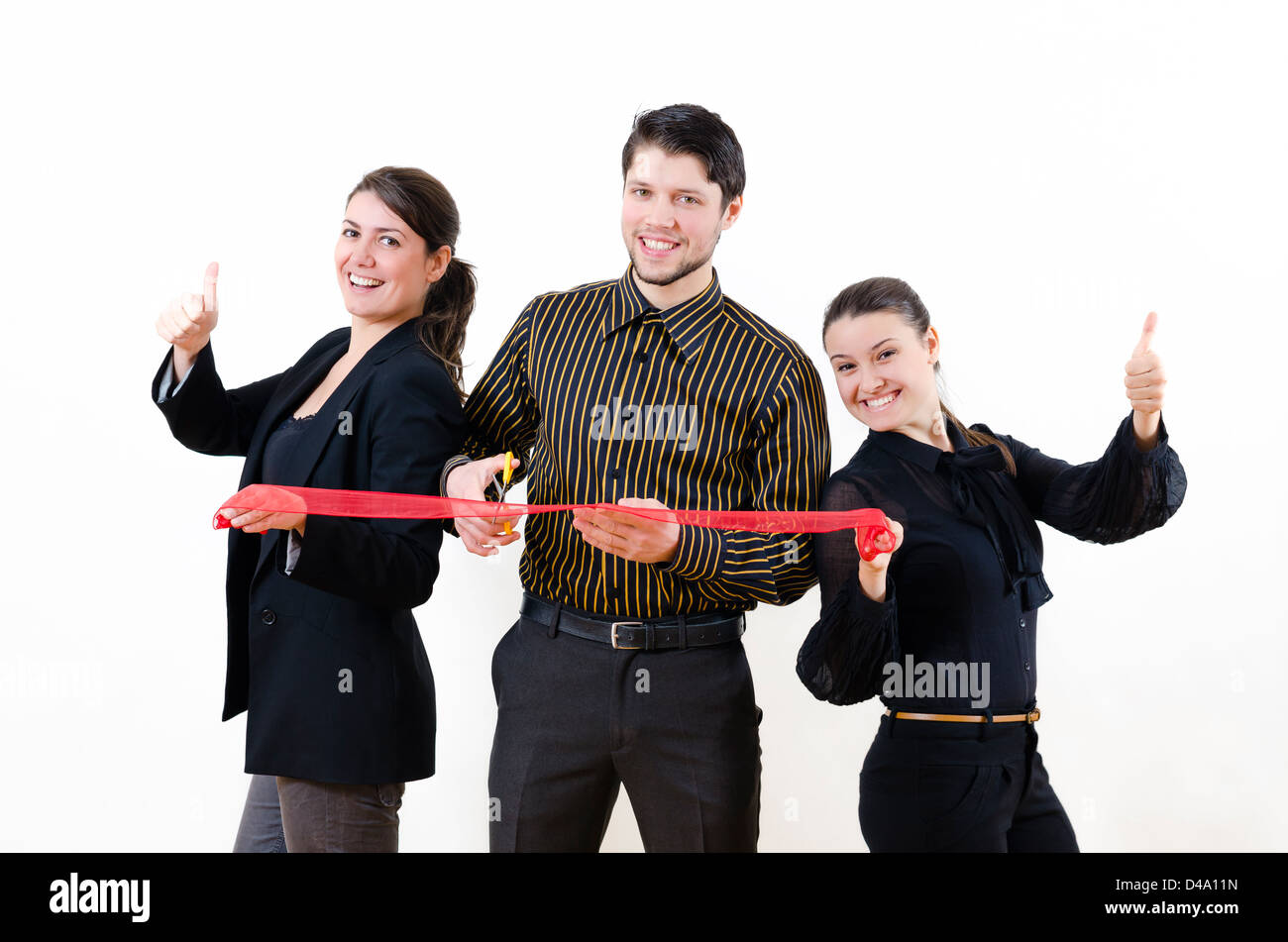 Business people team cutting a red ribbon Stock Photo - Alamy
