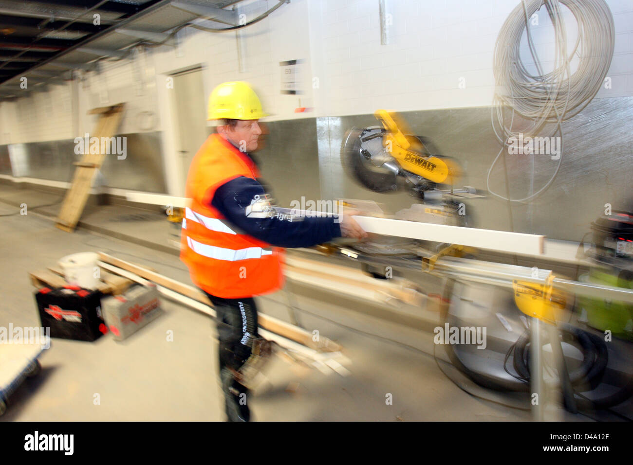 Schoenefeld, Germany, construction workers working on a Saw at the BBI ...