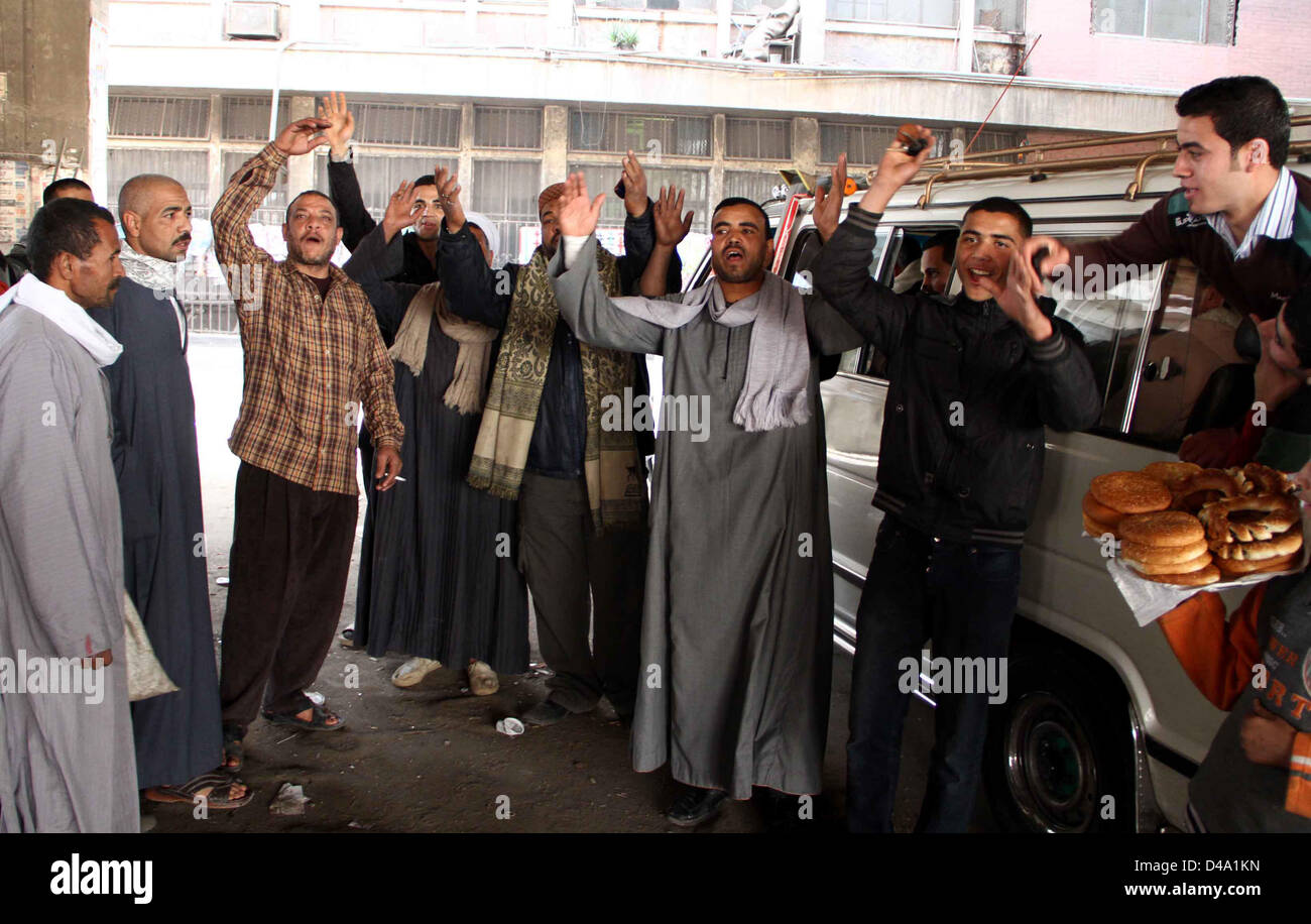 Cairo, Egypt. 10th March, 2013. Egyptians microbus drivers park their ...