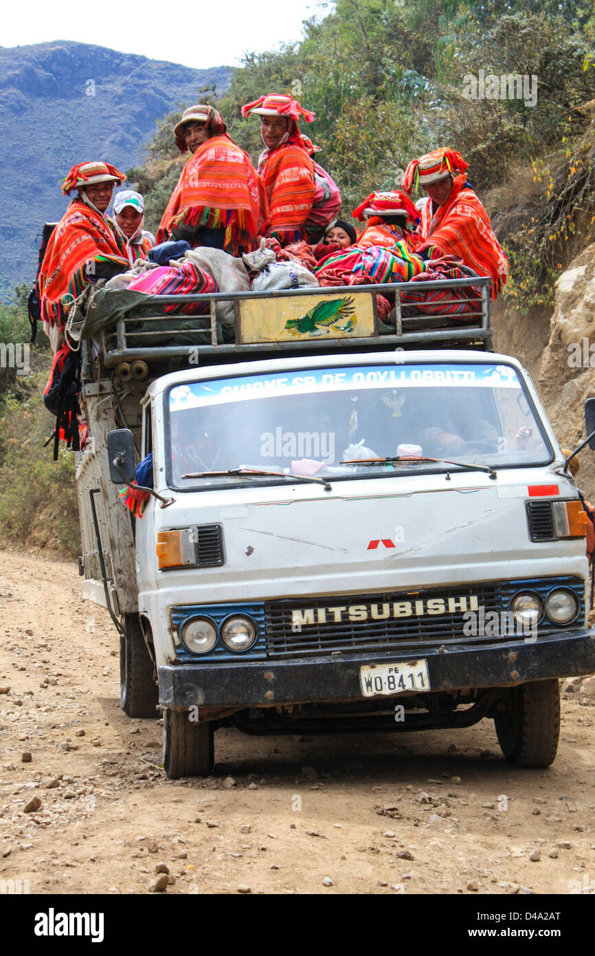 Indigenous people sitting on top of a truck, Andes Mountains, Peru ...