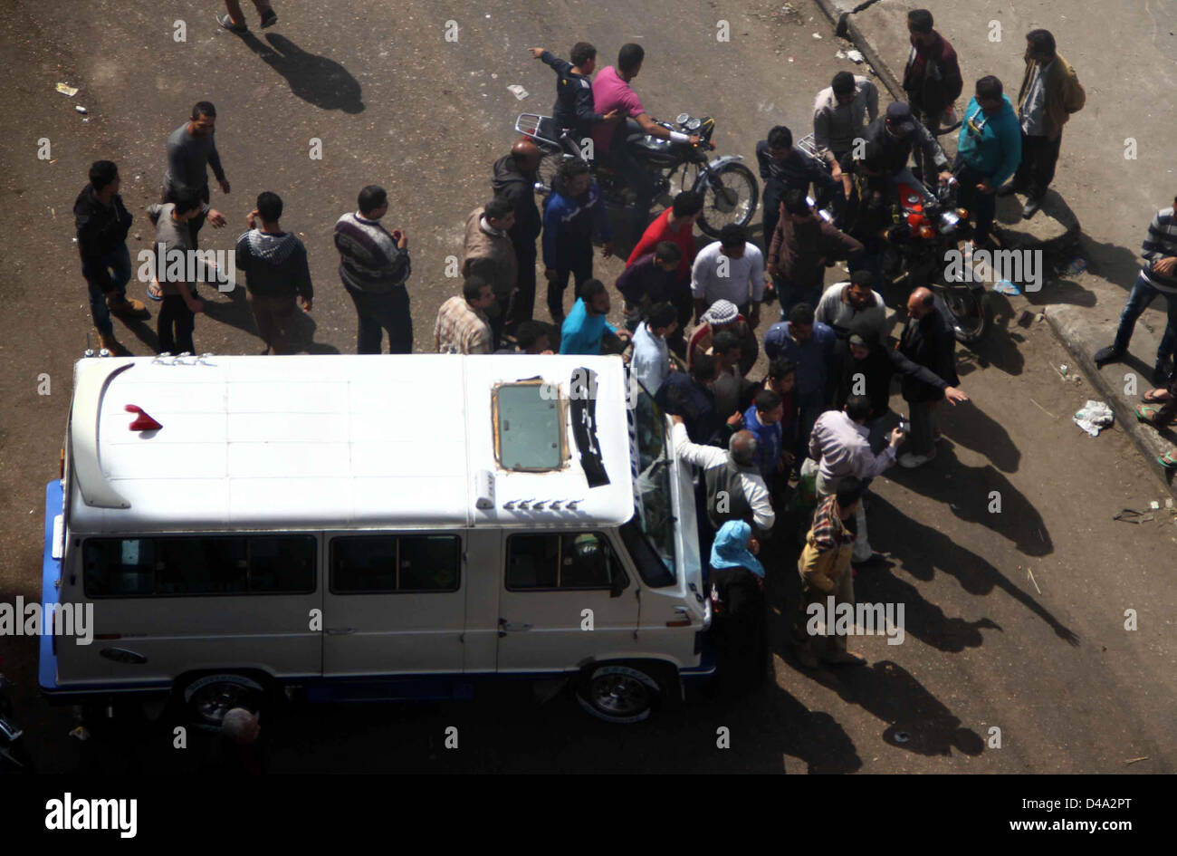 Cairo, Egypt. 10th March, 2013. Egyptians microbus drivers park their ...