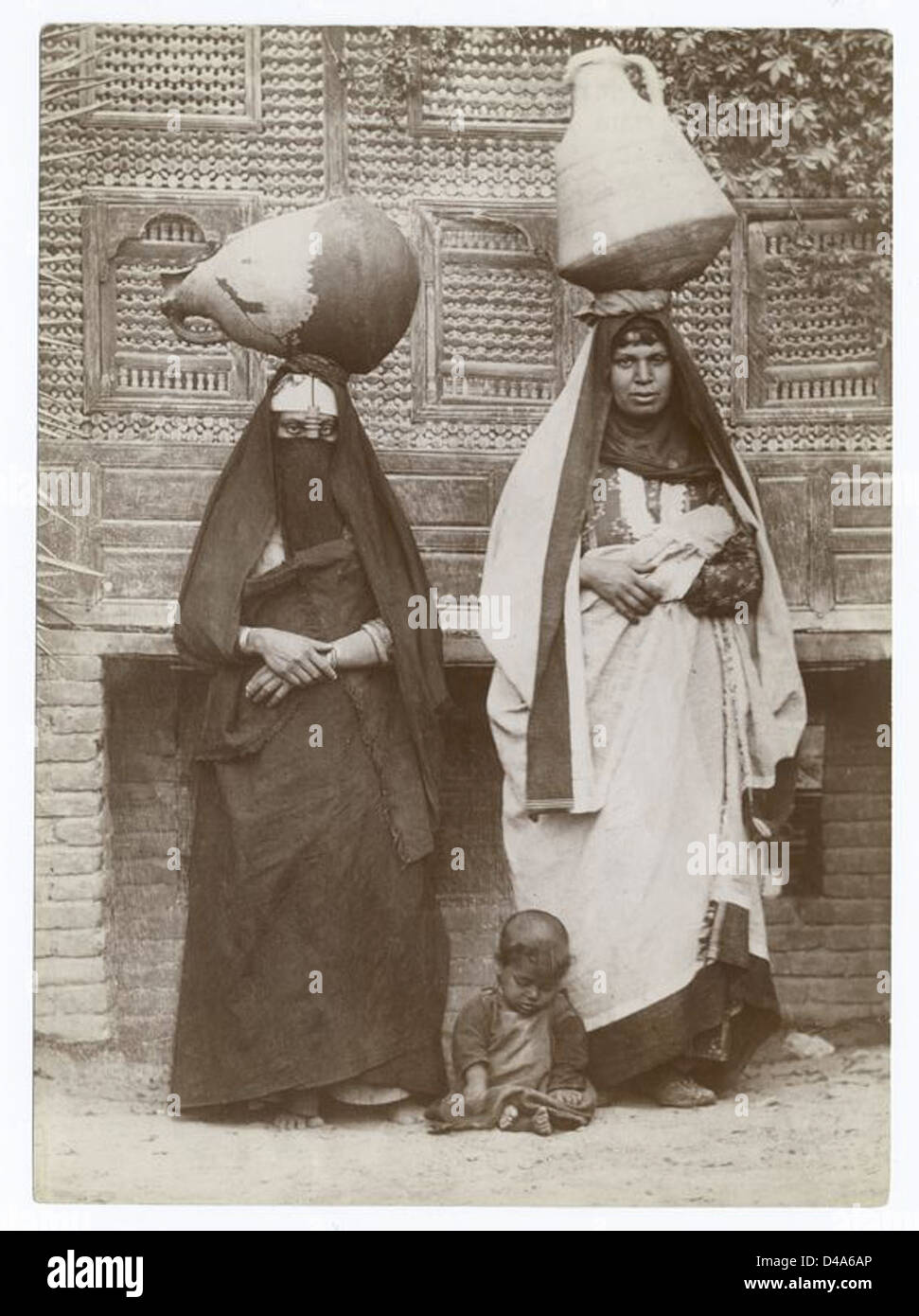 A photograph from the 1860s showing Fellah women in Egypt, dressed in ...