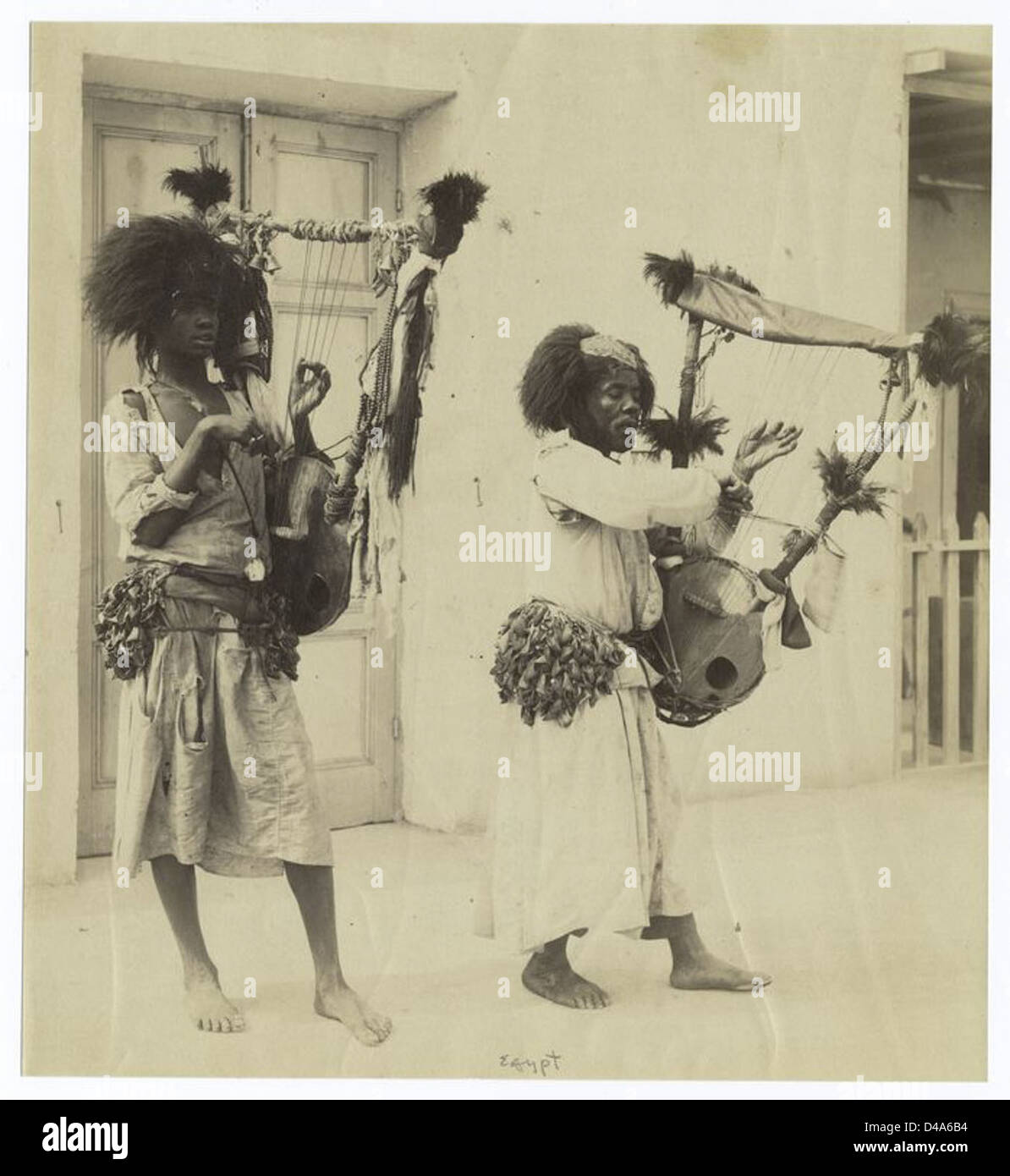 A historical image from Egypt featuring a musician playing a stringed ...