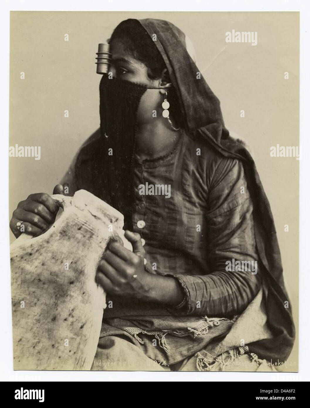 A 1860s photograph of an indigenous woman from Cairo, Egypt, wearing ...
