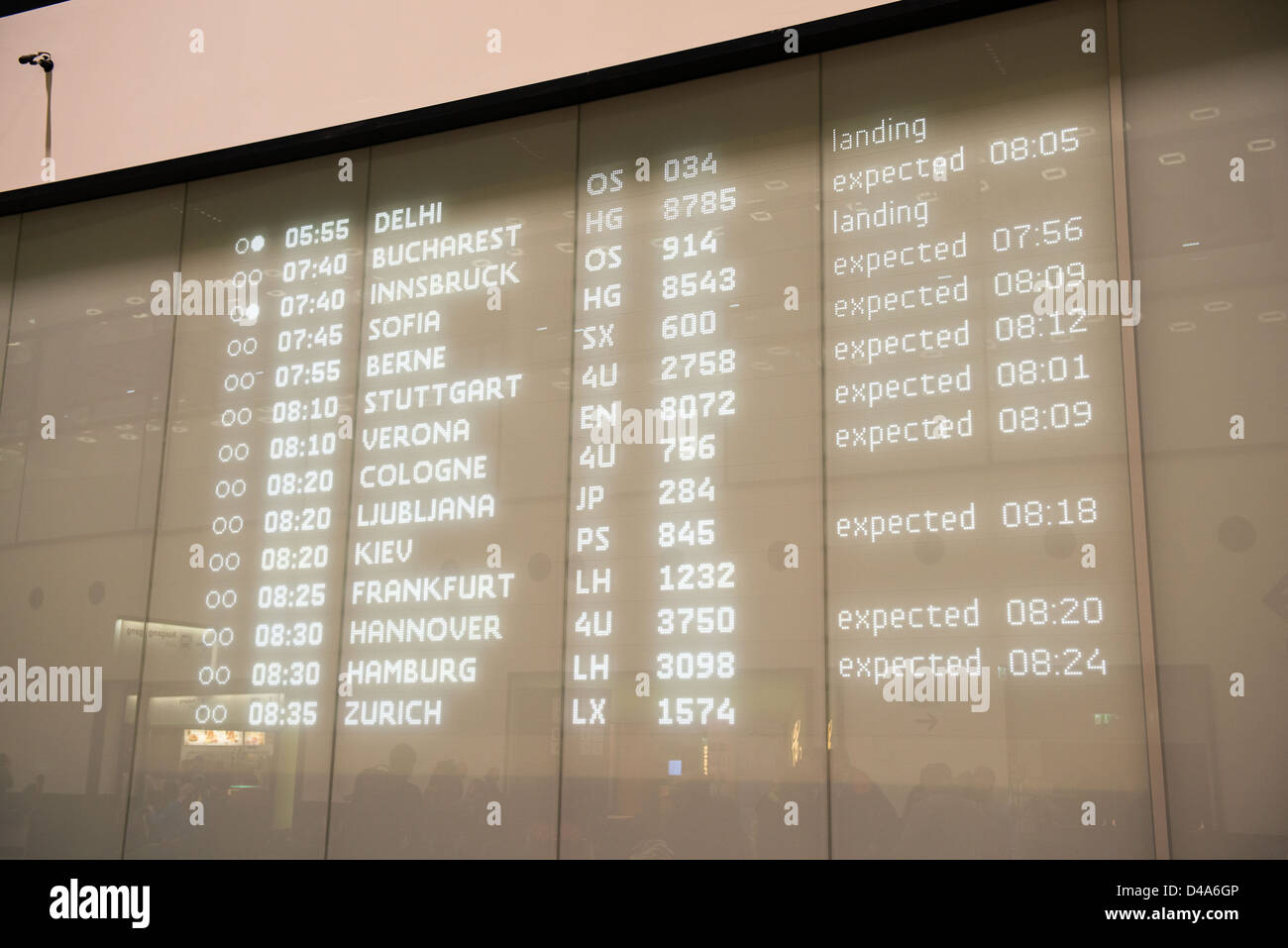 Modern flights information board in airport terminal Stock Photo - Alamy