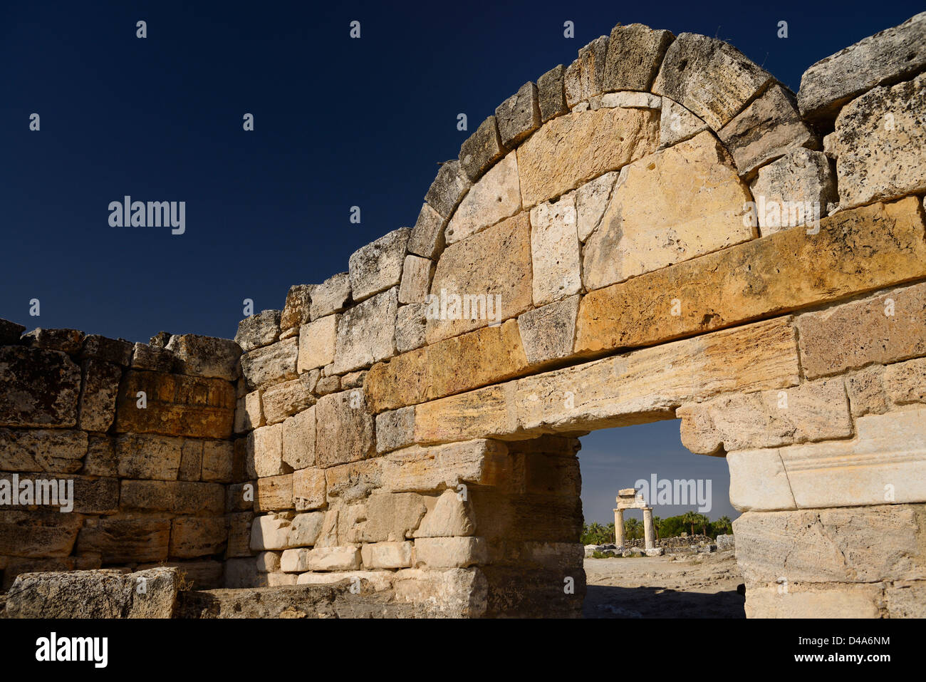 Ancient columns with lintel of Greco Roman temple seen through the ...