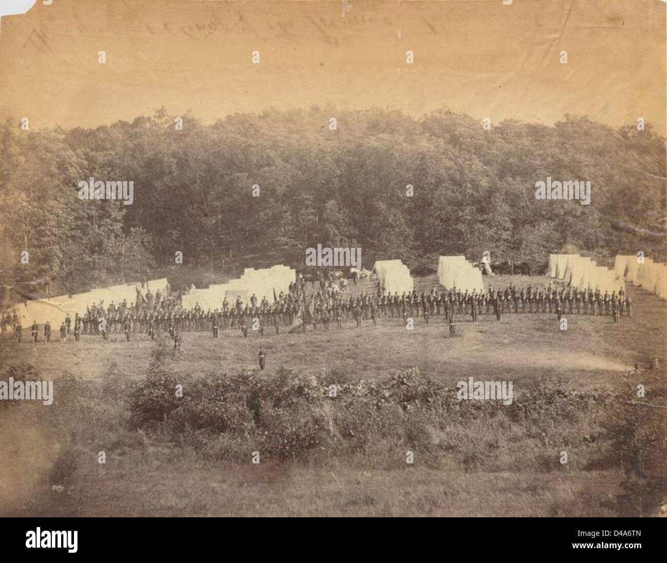This 1865 photograph shows an elevated view of troops and officers at the Gettysburg battlefield ...
