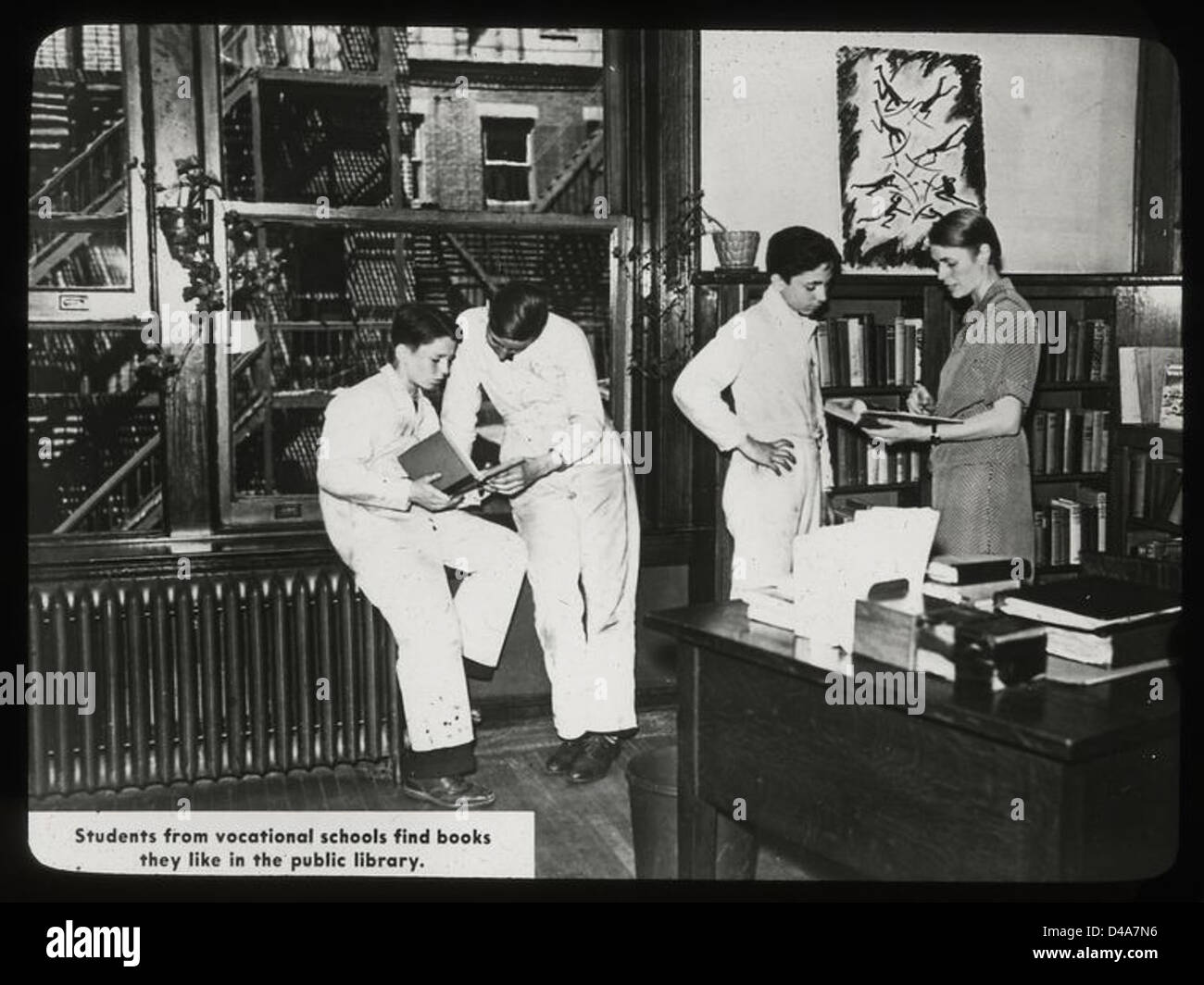 This image from 1938 shows students in a reference room, working with ...