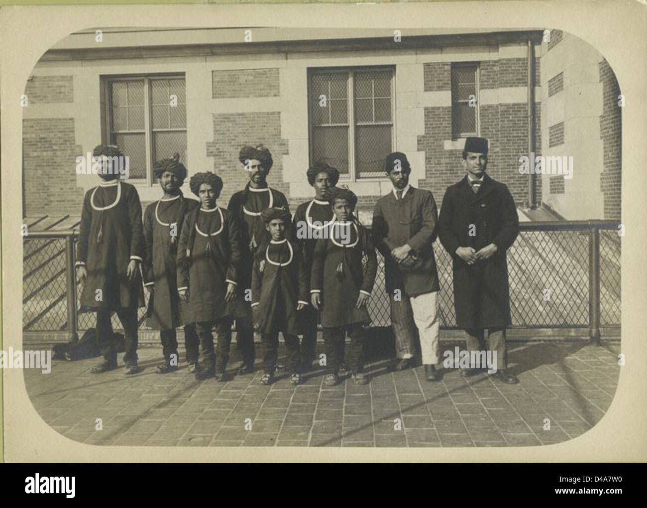 This group photograph from 1910 shows newly-arrived immigrants at Ellis ...