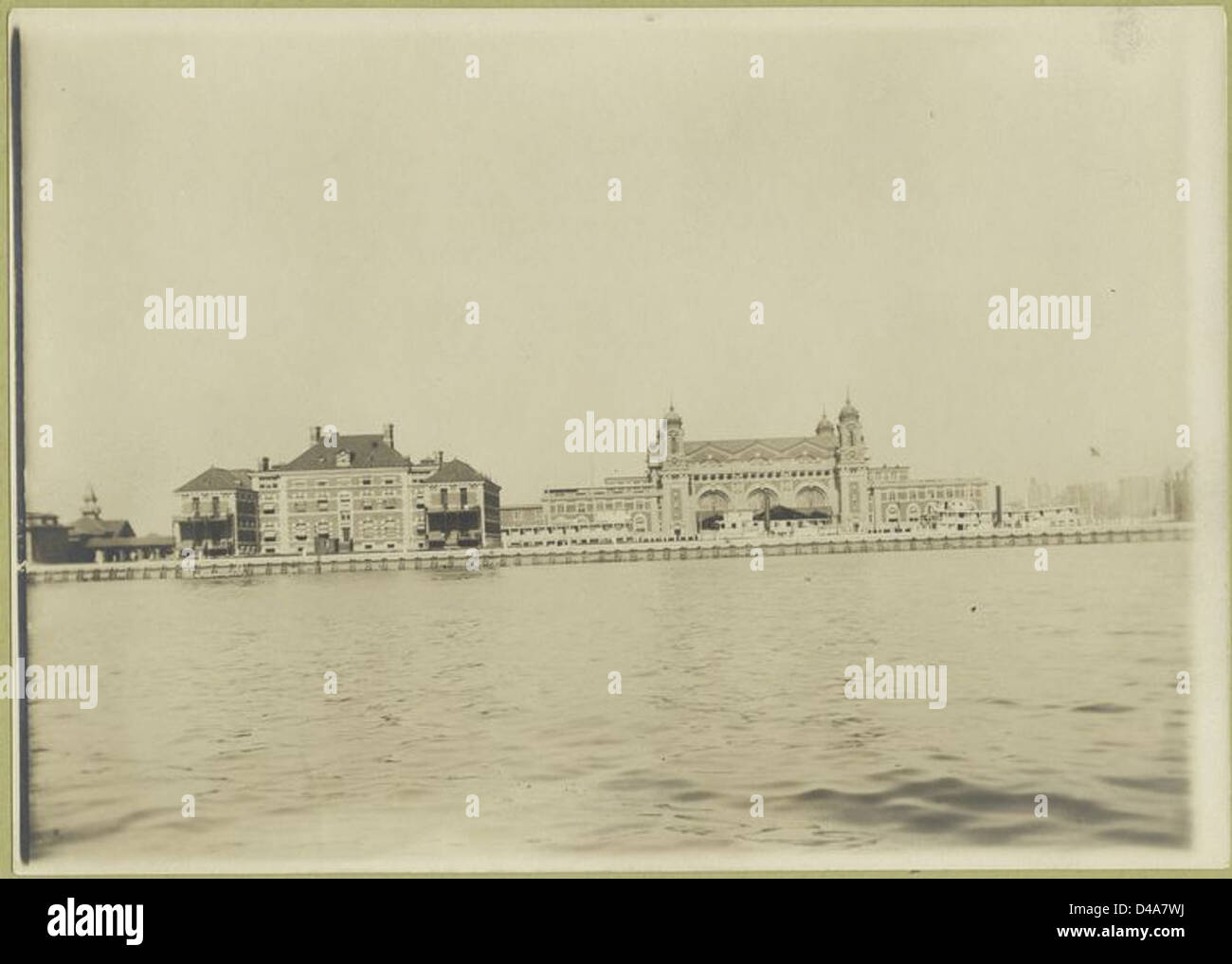 A photograph from 1910 showing a view of Ellis Island from New York ...