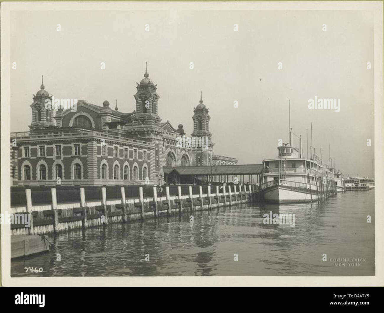 Ellis Island's Immigrant Station and a ferry dock, shown in a 1910 ...