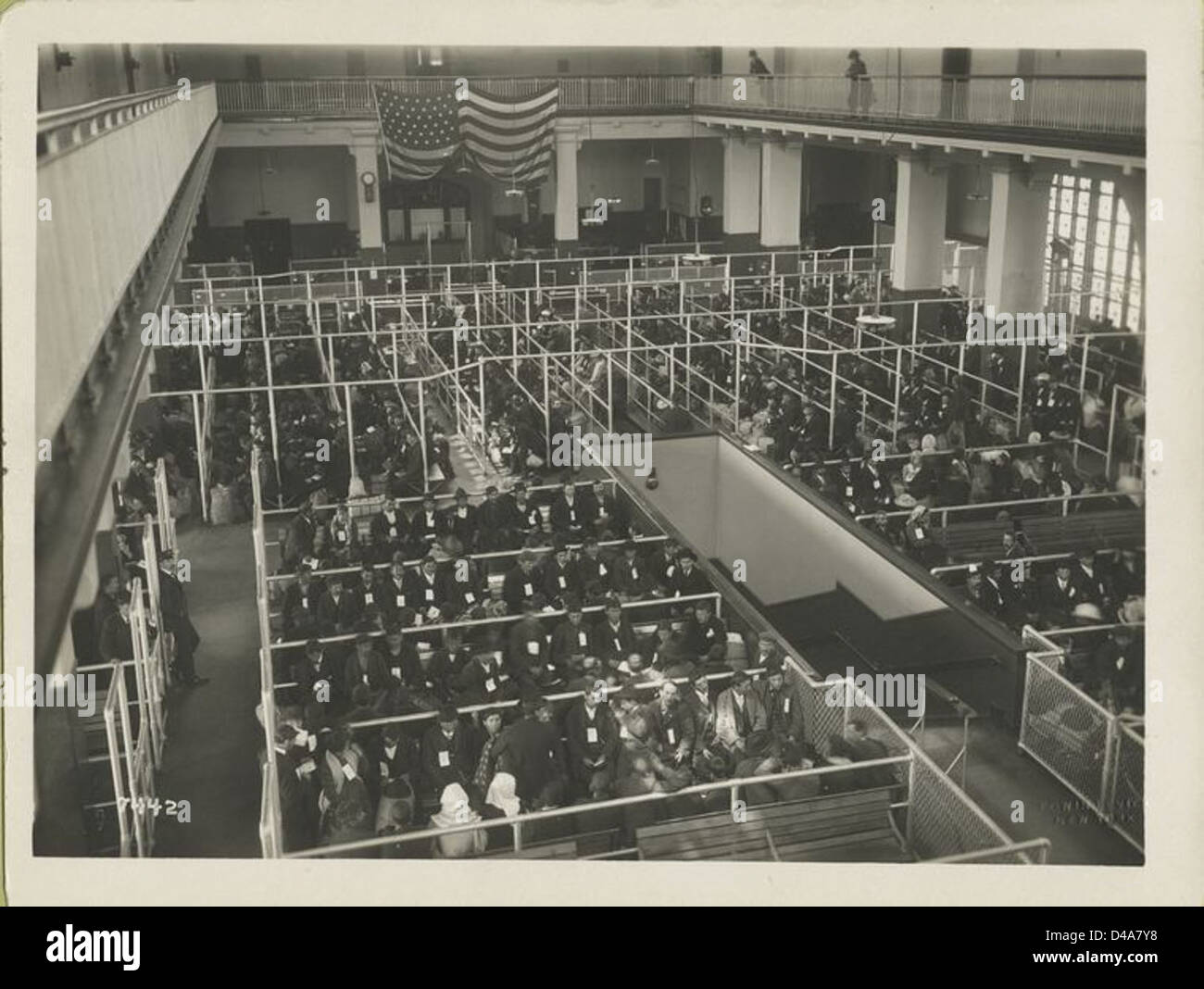 The pens at Ellis Island, main hall. These people have passe Stock ...