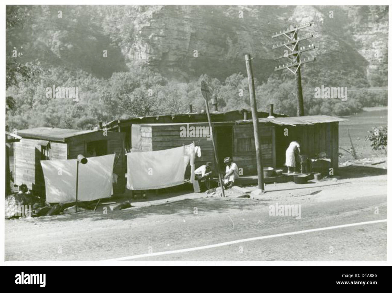 This photograph from 1938 shows shacks inhabited by African American ...
