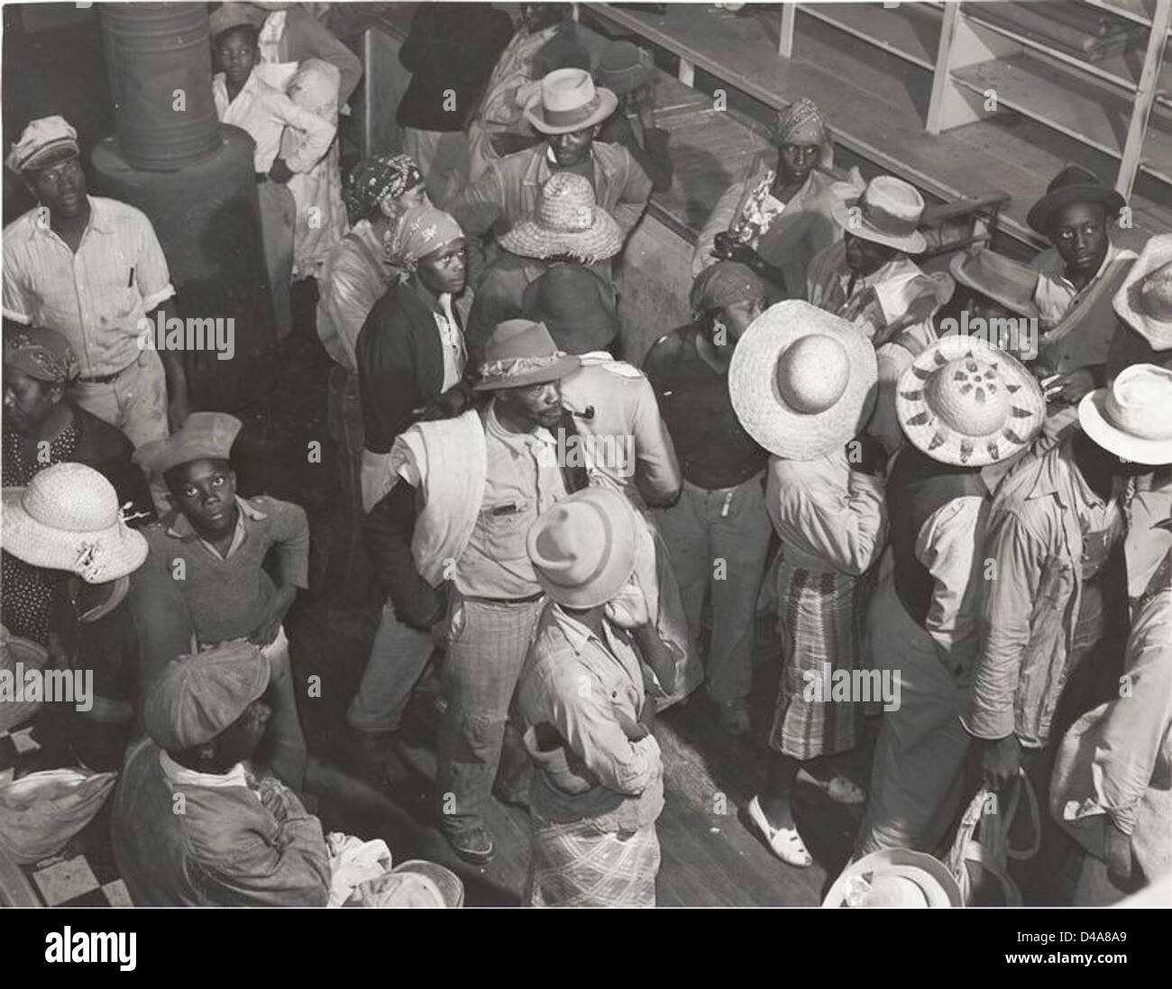 A photograph from the 1930s shows African American day laborers brought ...