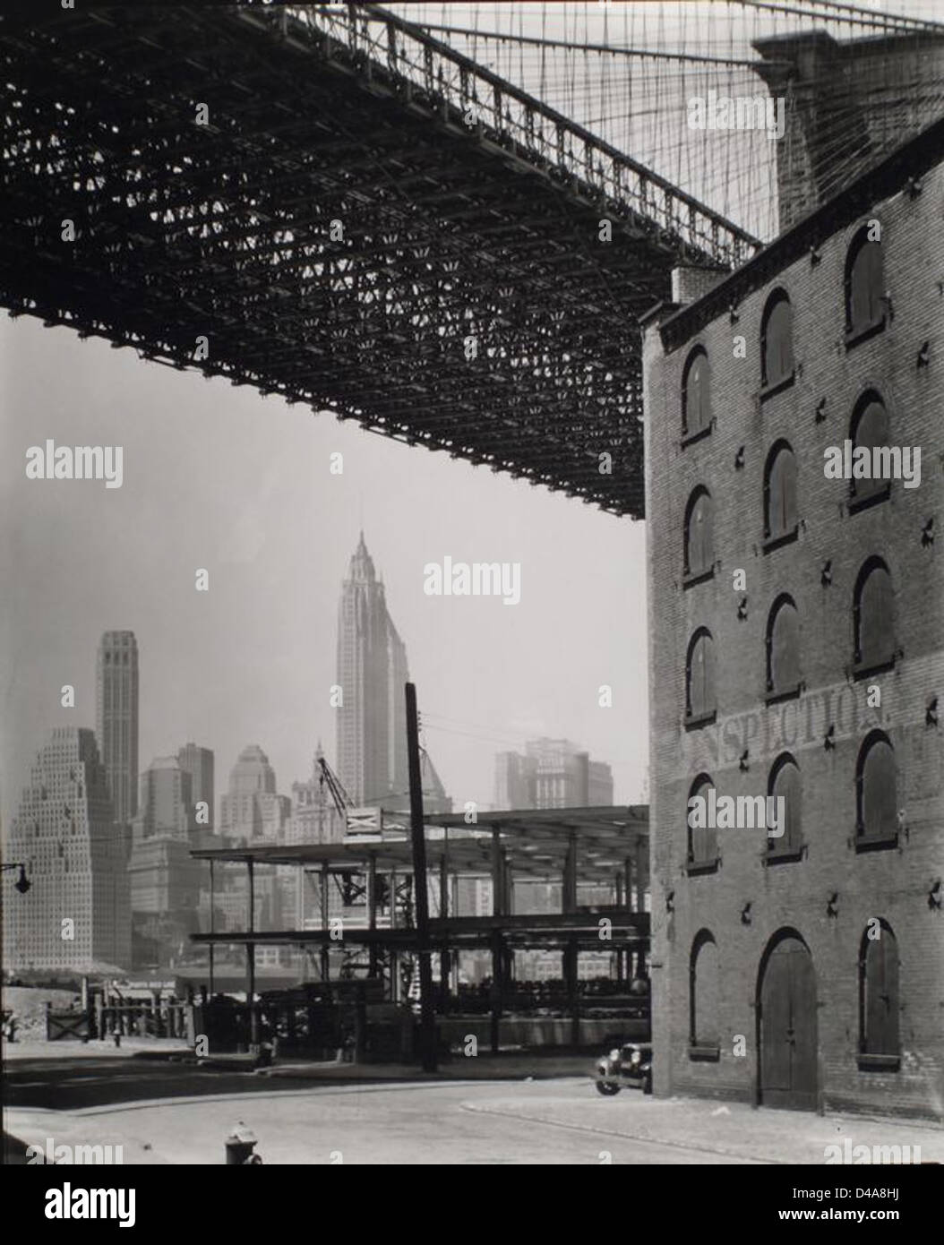 A photograph by Berenice Abbott from 1936 showing the Brooklyn Bridge ...