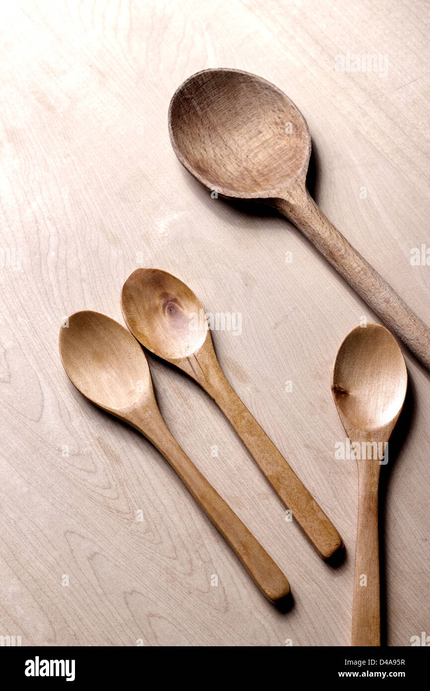 Wooden spoons lying on a table Stock Photo - Alamy