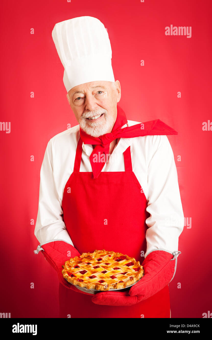 Baker or chef holding a freshly baked lattice top cherry pie Stock ...