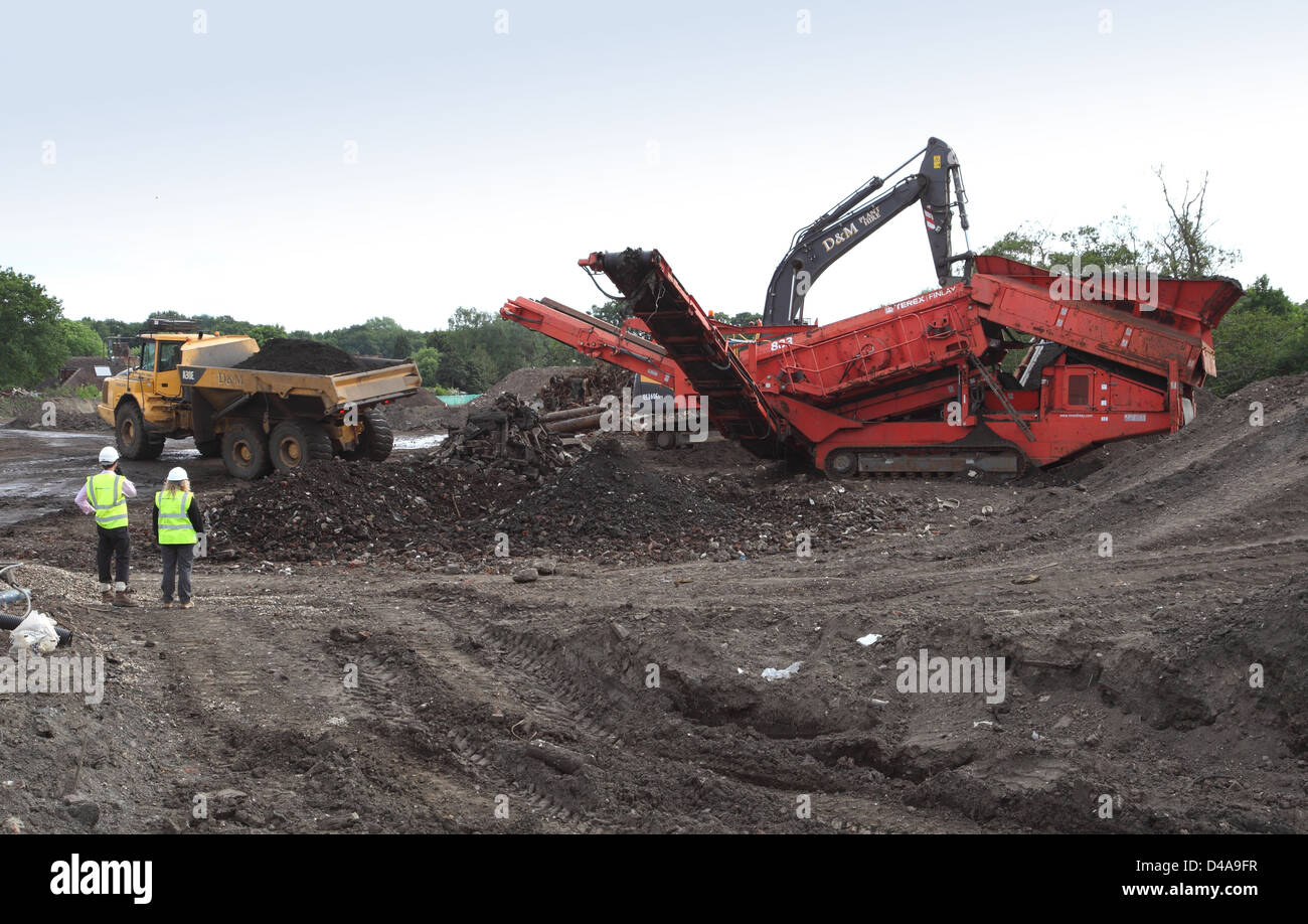 A mobile crushing and screening machine in operation on a land ...