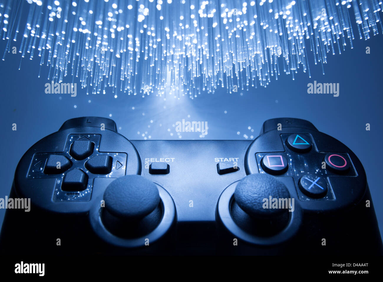 Game controller and blue light Stock Photo - Alamy