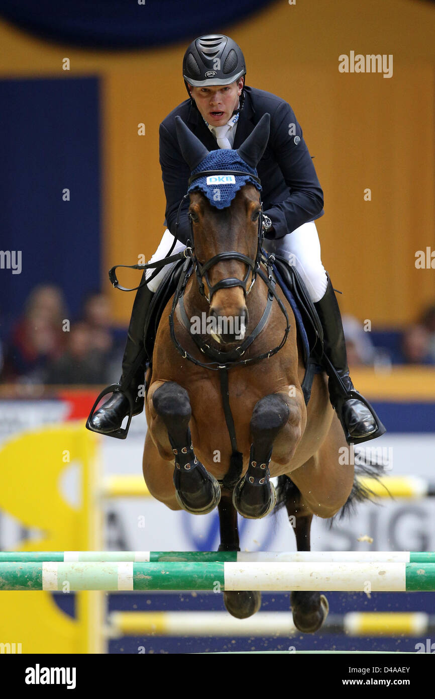 German horse jumper Lars Nieberg performs his skills with his horse ...