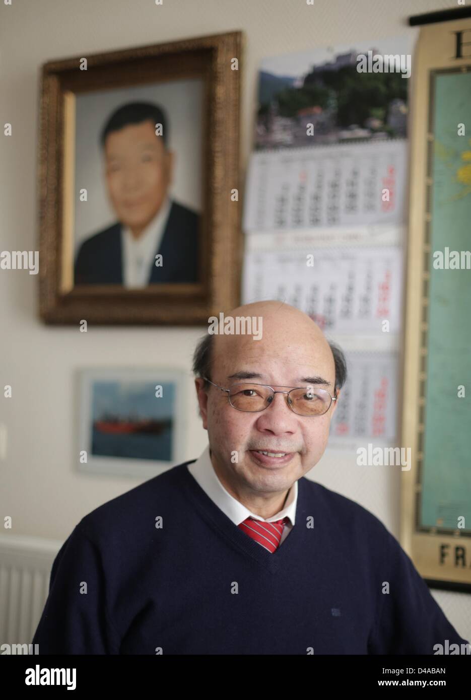 Chinese businessman Martin Chen is pictured in front of a portrait of ...