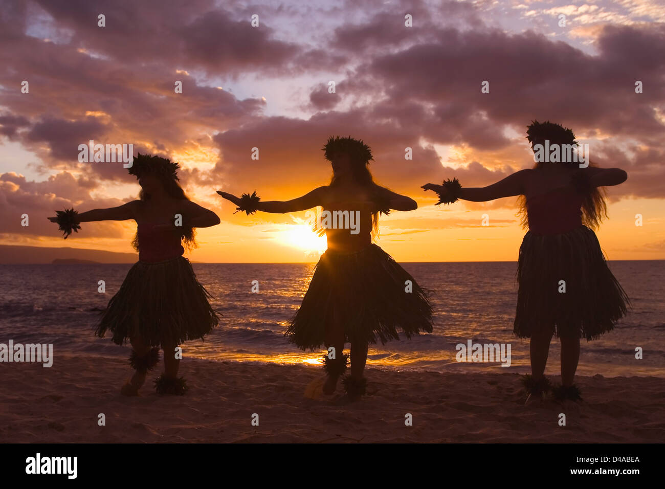 Three hula dancers at sunset at Palauea Beach, Maui, Hawaii Stock Photo ...
