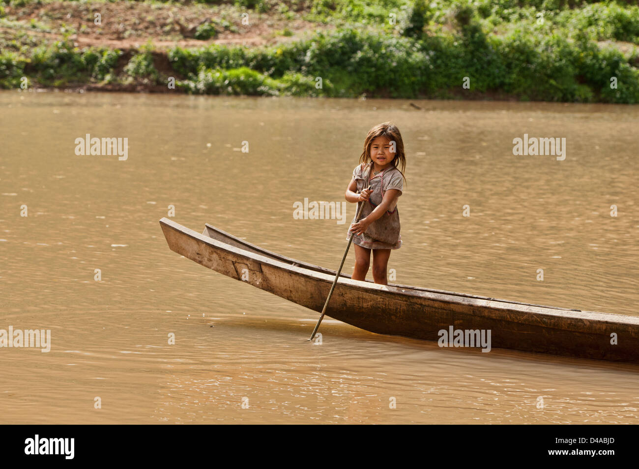 Lanten Girl In Her Dugout Canoe On The Nam Ha River Luang Nam Tha