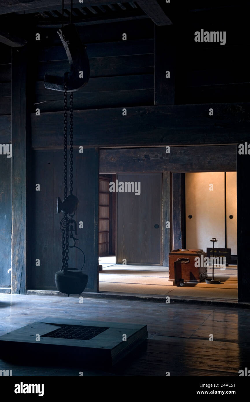 Historic village folk house interior with irori fire pit and jizaikagi ...