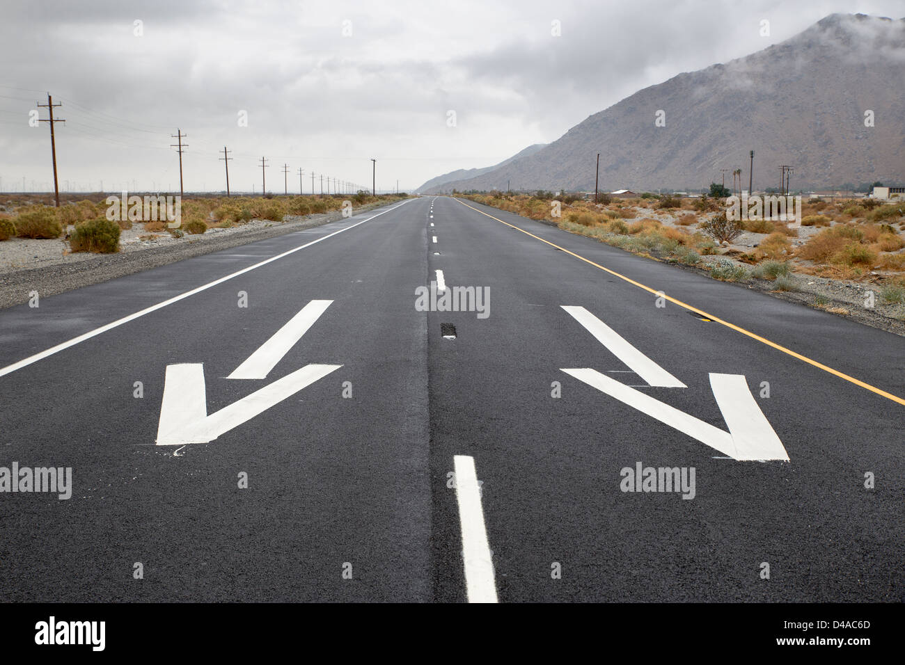 Road with two arrows painted on the asphalt, outside Palm Springs ...
