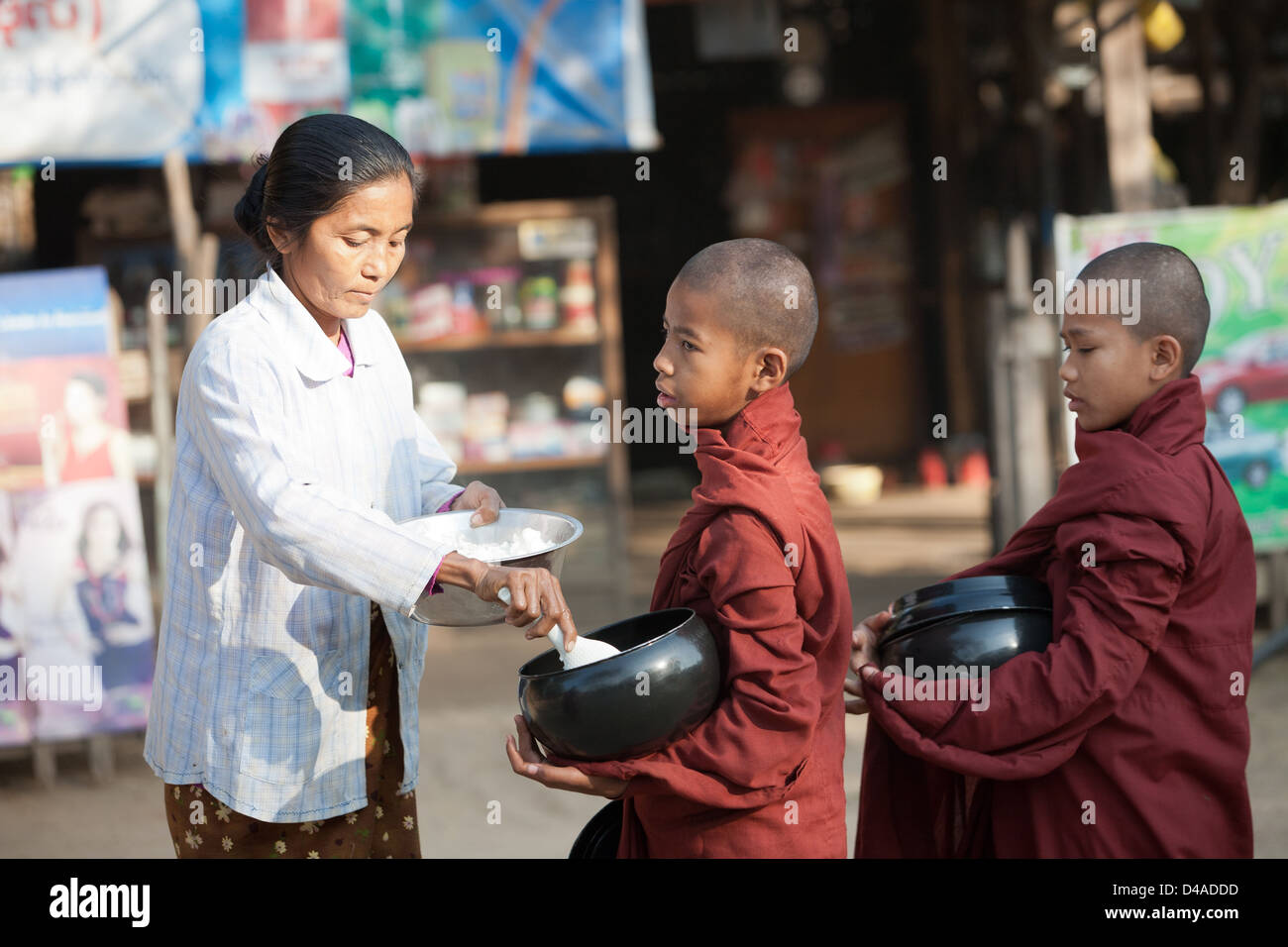 Buddhist monks receiving rice in Bagan rural Burma Stock Photo - Alamy