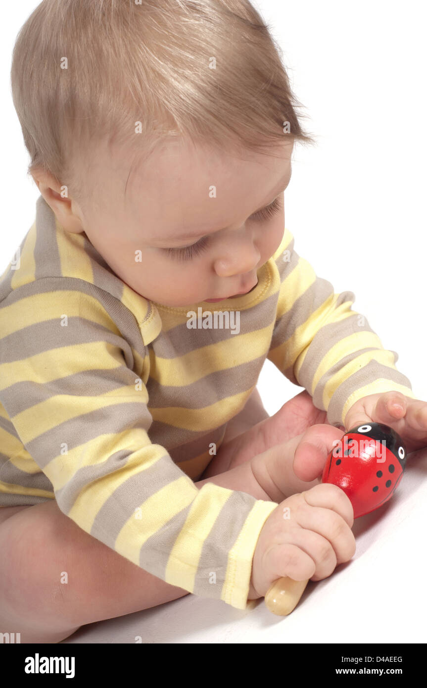 Little cute boy with toy in studio Stock Photo - Alamy