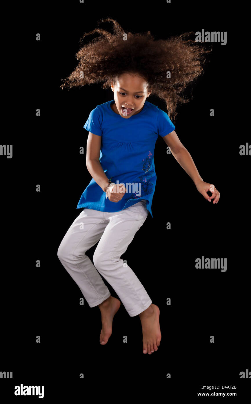 Black kid jumping hi-res stock photography and images - Alamy