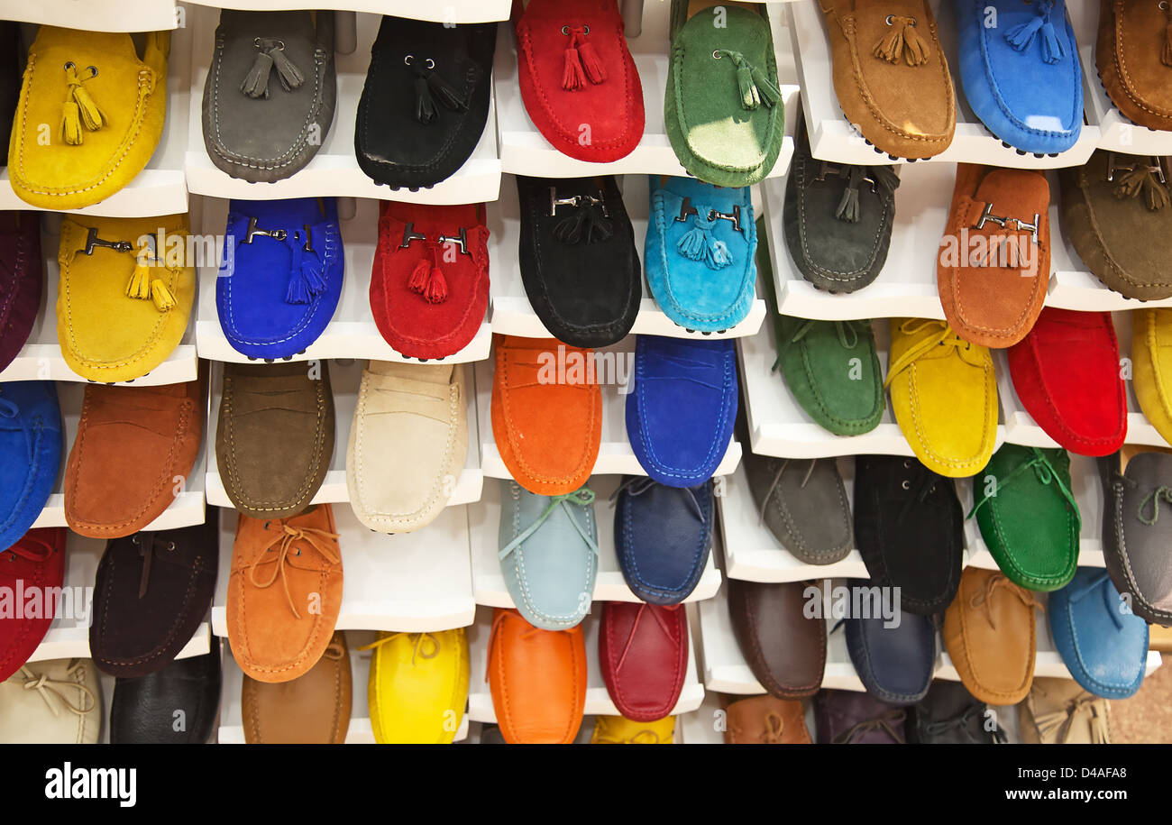 variety of the colorful leather shoes in the shop Stock Photo - Alamy