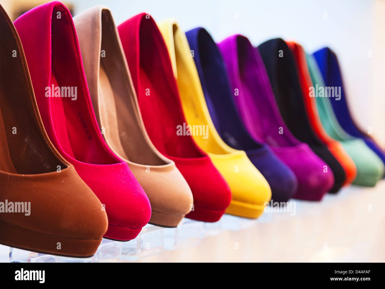 variety of the colorful leather shoes in the shop Stock Photo - Alamy