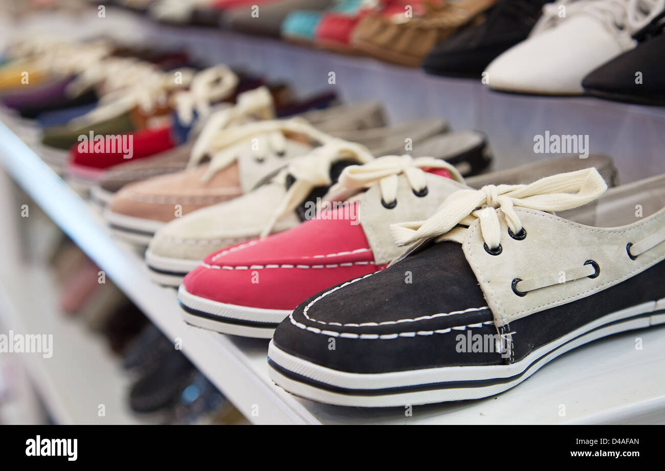 variety of the colorful leather shoes in the shop Stock Photo - Alamy