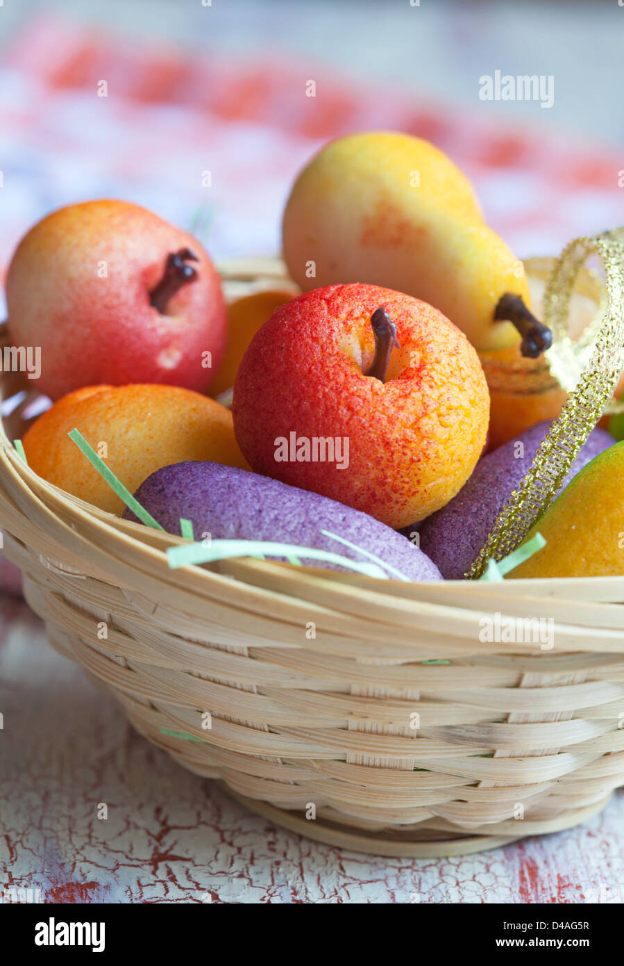Fruit shaped candies in macro image of marzipan sweets in a basket on ...