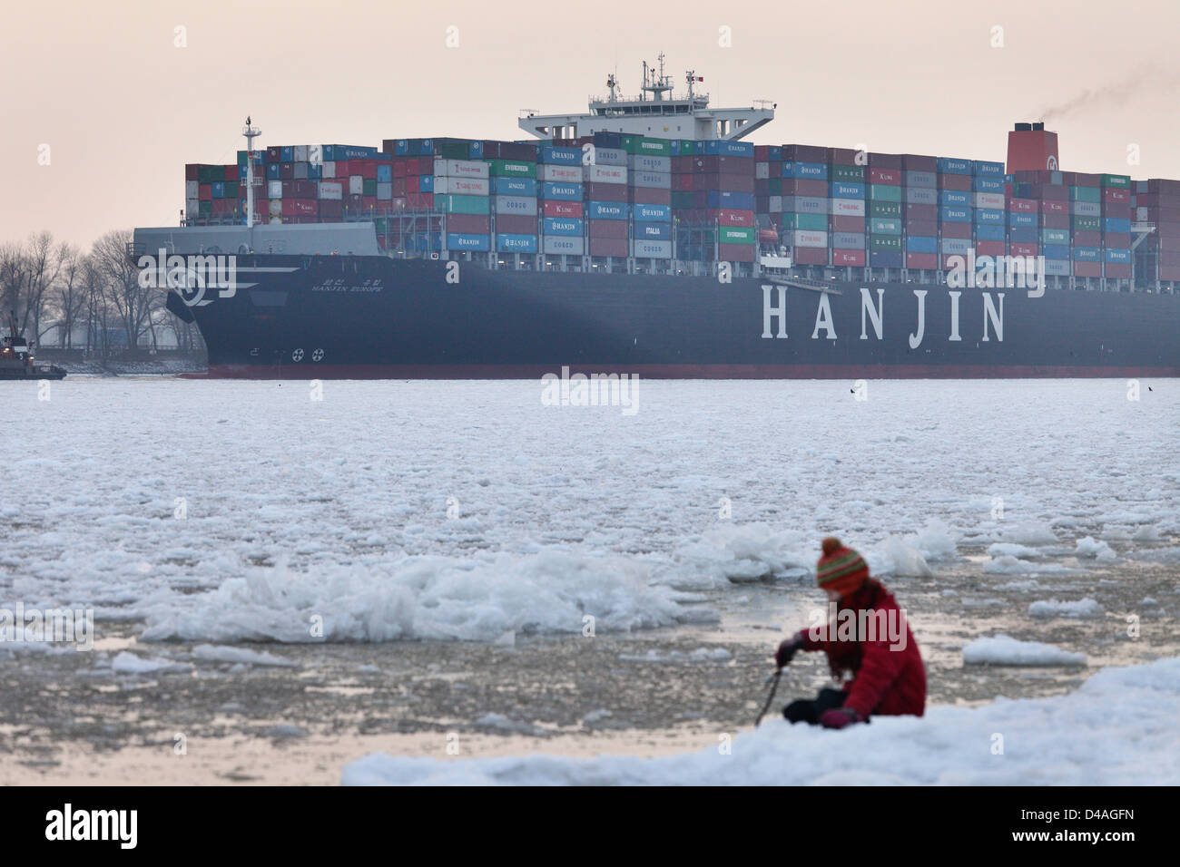 Hamburg, Germany, a child playing on the Elbe River and the container ...