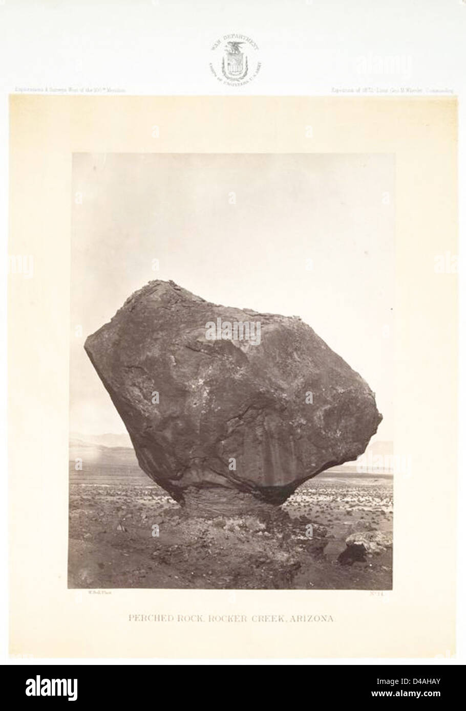 A photograph from a geological survey showing a perched rock formation ...