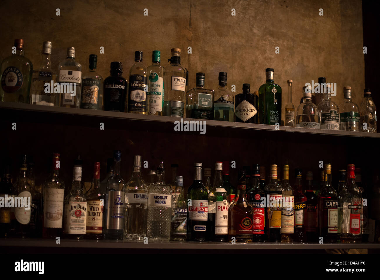 Shelves full of different alcoholic beverages bottles in the Minibar in ...