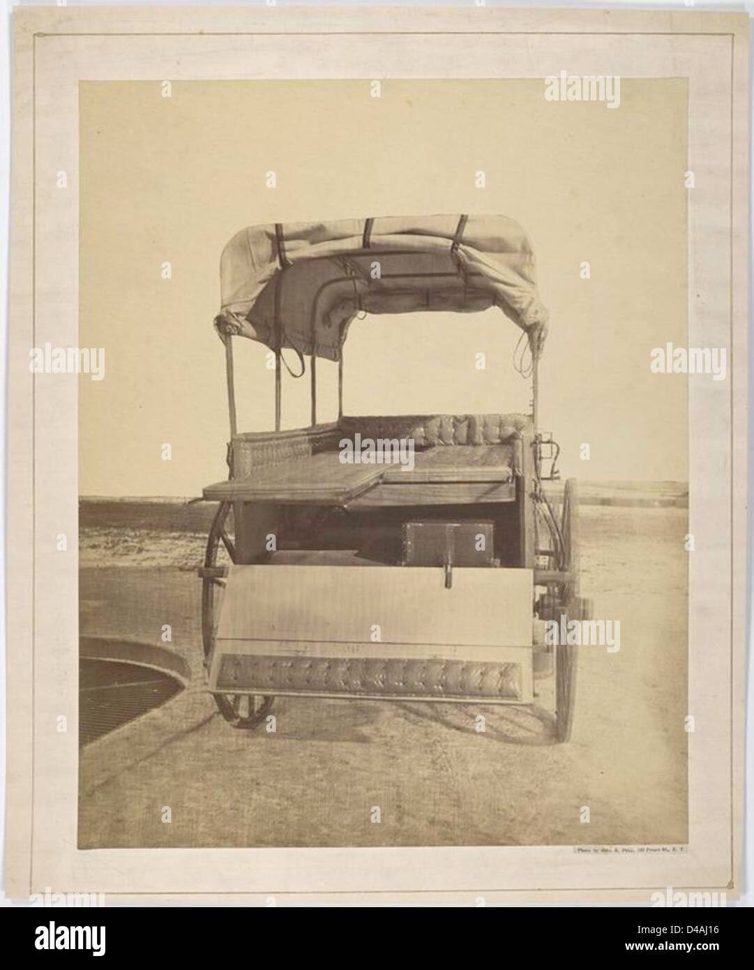 This 1869 photograph shows a Howard ambulance with its tailgate down ...