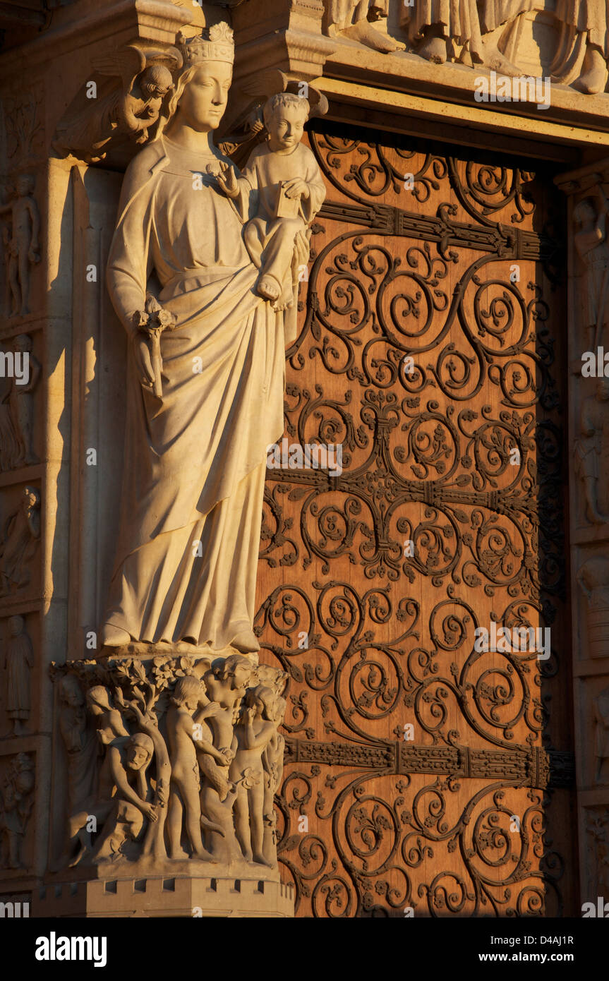 Our Lady of Paris. A statue of Mary and the infant Jesus on the trumeau ...