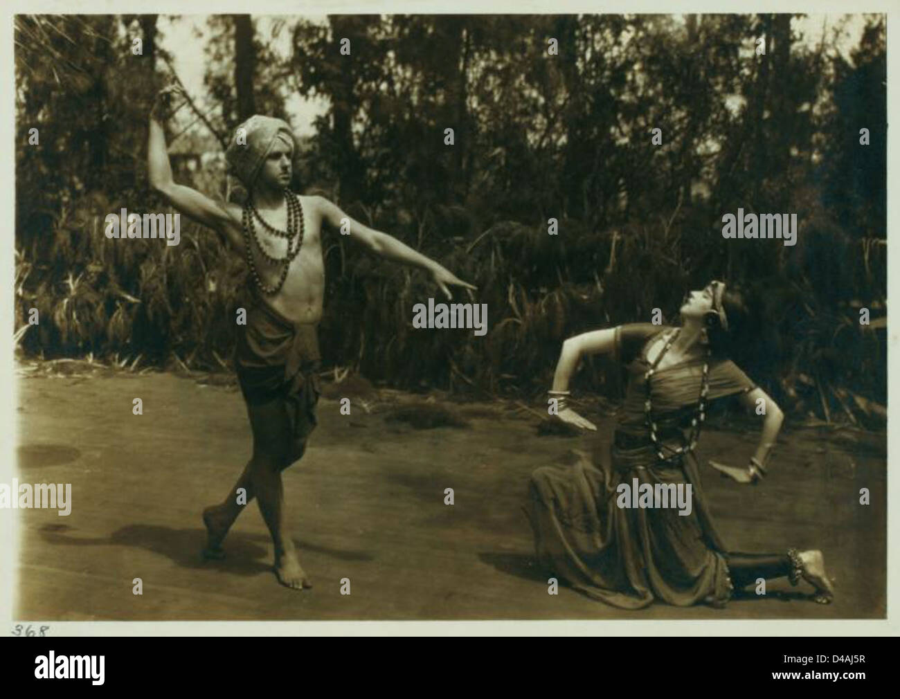 Ruth St. Denis and Ted Shawn are photographed outdoors in dance ...