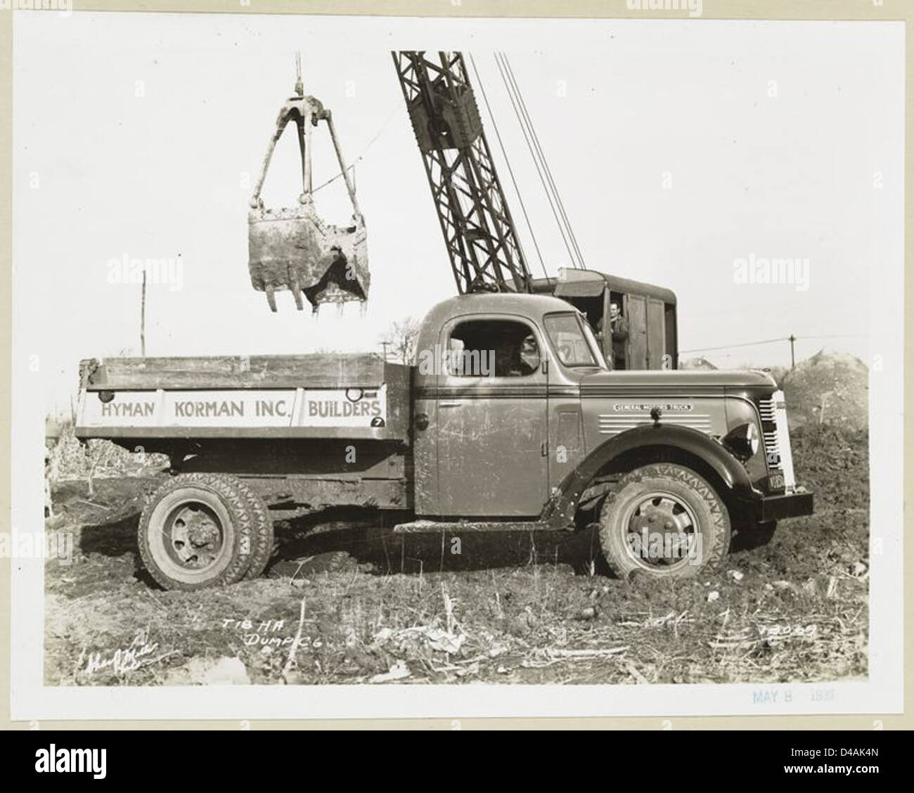 This 1925 photograph shows a Model T 18 HA truck loading gravel for ...