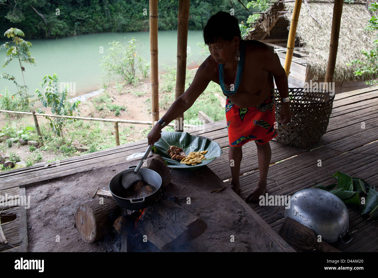 Embera indian woman making food at the Embera Puru village, Rio Pequeni ...