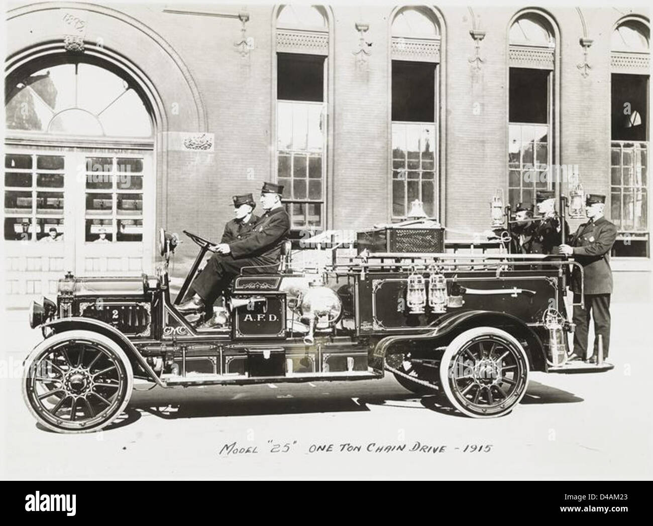 A photograph of a 1915 Model 25 fire truck, featuring a chain drive ...
